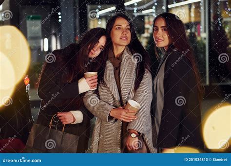 Cups Of Drink In Hands Three Cheerful Women Spends Christmas Holidays