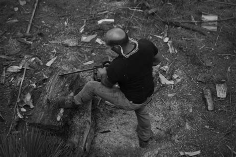 Premium Photo Full Length Of Man Cutting Log