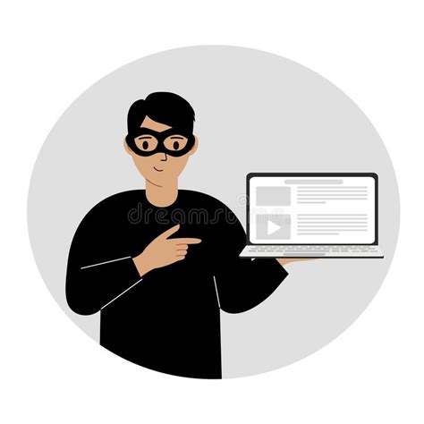 Hacker In A Black Mask With A Computer The Cybercriminal Is Holding A