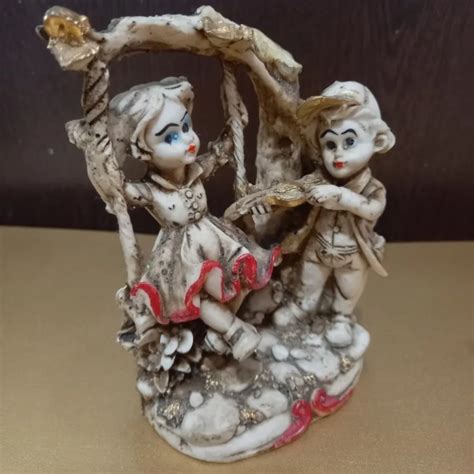 کمدا قیمت و خرید مجسمه دختر و پسر