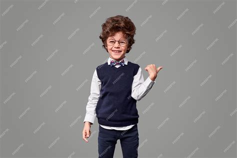 Premium Photo Cheerful Nerd Pointing Aside