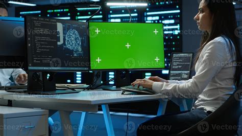 Technician Doing Checkup On Green Screen Server Hub Pc To Optimize It For Data Processing