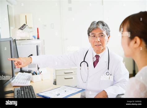 Patient Being Examined By A Japanese Doctor In A Doctor S Office Stock Photo Alamy