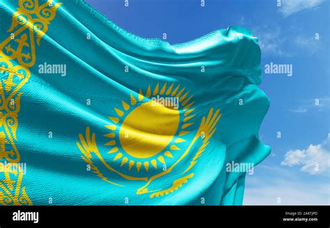 Kazakhstan Flag Is Waving Against Blue Sky With Clouds Realistic