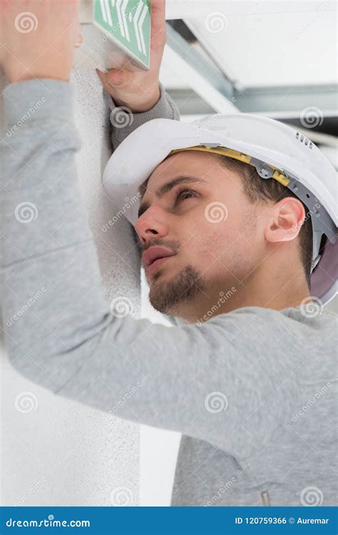 Man Fitting Directional Exit Sign Stock Photo Image Of Route Warning 120759366