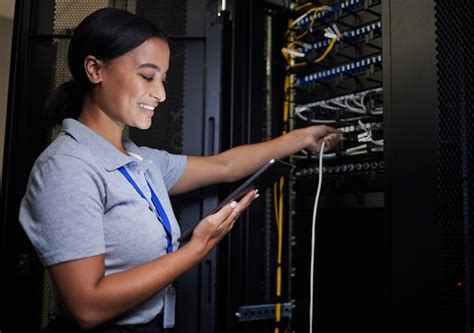 Premium Photo Server Room Tablet And Engineer Woman With Connection Cable For Maintenance Or