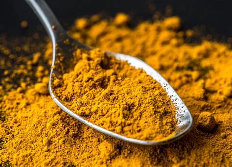 Closeup Of Tumeric Powder Spice On A Spoon Royalty Free Photo 52581