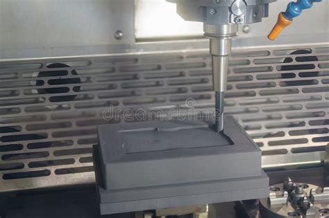 The Cnc Milling Machine Rough Cutting The Graphite Electrode Parts Stock Image Image Of