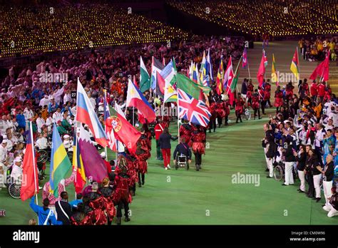 Athletes Carry Their Countries Flags Into Olympic Stadium At The