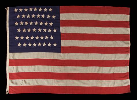 48 Stars In Staggered Rows On An Antique American Flag Made Between