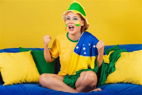 Premium Photo Caucasian Woman Redhead Brazilian Soccer Fan Brazilian On Couch Screaming Goal