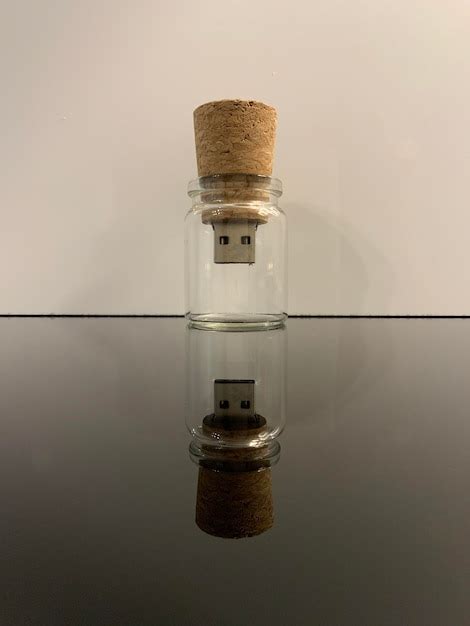 Premium Photo Close Up Of Usb Stick On Table Against White Background