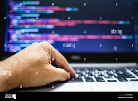 the programmer s hand is writing the source code programmers write