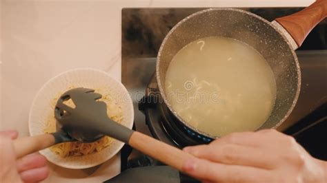 Pov Hands Cooking Instant Noodle Soup At Home Female Hand Stirring