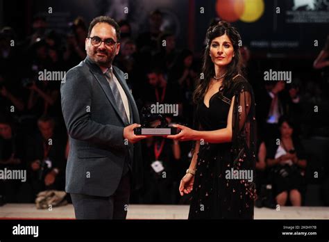 venice italy september 10 reza heydari and mina kavani pose with the special jury prize for