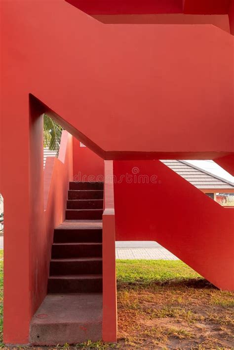 A Vibrant Red Architectural Structure Angular Walls And A Set Of A Vibrant Red Architectural Structure Angular Walls And A Set Of