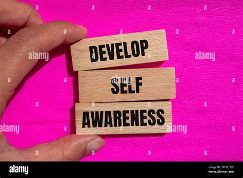 Develop Self Awareness Message Written On Wooden Blocks With Pink