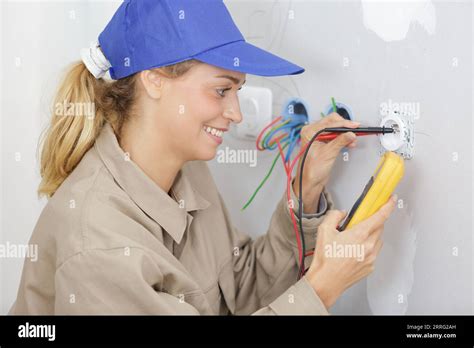 Portrait Of A Woman Measuring Electrical Current Stock Photo Alamy