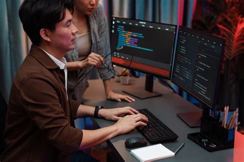 Premium Photo It Developers Discussing With Point Website Coding