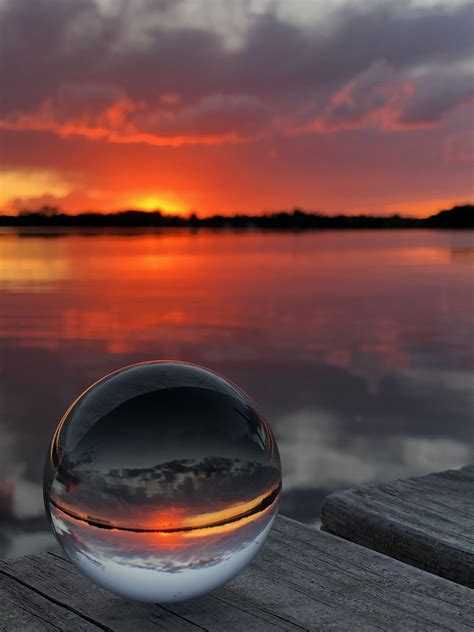 Glass Ball With Beach Reflection Sunset Reflection In Glass Ball