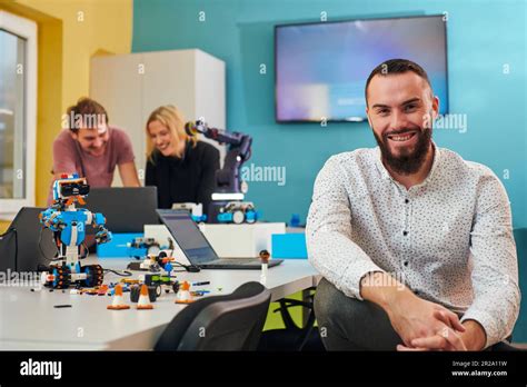 A Man Working In A Robotics Laboratory Focusing On The Intricate Fields Of Robotics And 3d
