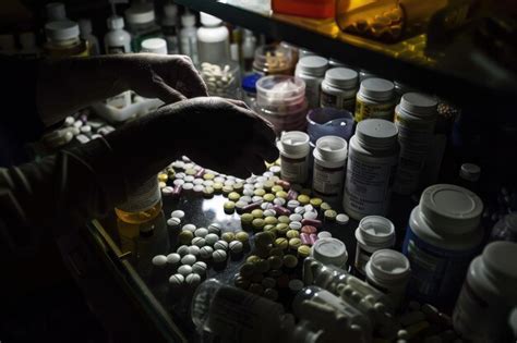 Dark And Moody Image Of Scattered Pills On A Dusty Surface With A Pill