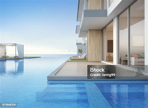 현대적인 디자인에 빈 테라스와 바다 전망 수영장 럭셔리 비치 하우스 라운지의 자 나무 바닥에 현대 홀리데이 빌라 외관의 휴가 가정 이나 호텔3d 일러스트에서 갑판 수영장