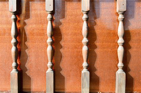 Wooden Beautiful Carved Figured Legs Sticks Columns On The Background