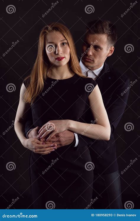 A Man Looks In Amazement At The Girl He Is Hugging Stock Image Image Of Erotic Adult 180958293