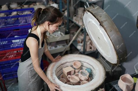 Premium Photo Beautiful Woman Making Ceramic Pottery On Wheel Hands Closeup Woman In Freelance