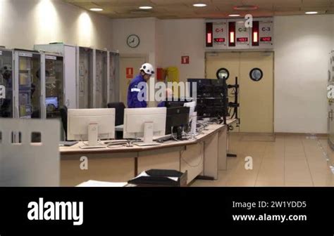 Men In Front Of Monitors Control A Nuclear Reactor At A Power Plant Stock Video Footage Alamy