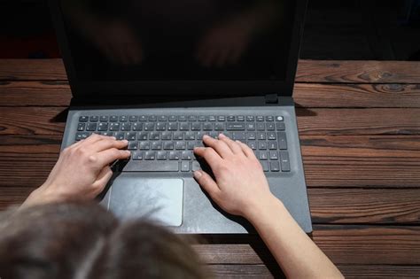 Premium Photo Hacker With Laptop And Abstract Binary Code