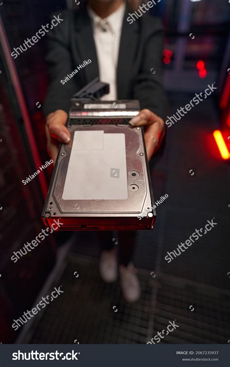 Female Technician Holding Hard Drive In Server Room Images Stock Photos D Objects