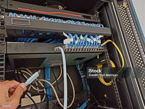 network technician setting up and configuring router switch using