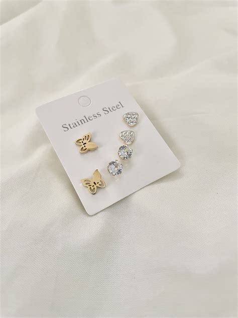 گالری کاکوله پک گوشواره طرح قلب و پروانه