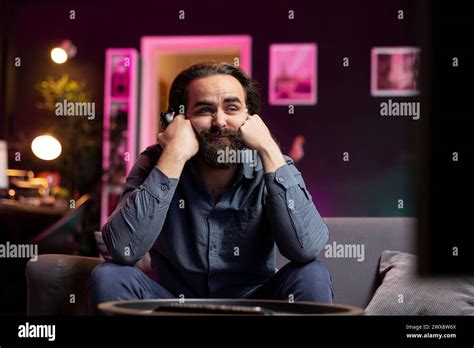 Depressed Man Looking Saddened At Tv Display While Playing Videogames Receiving Game Over