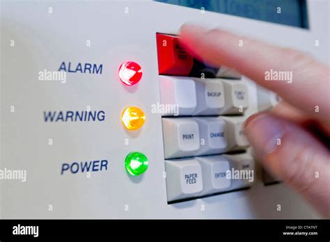 Hand Pushing Button On Alarm System Germany Stock Photo Alamy