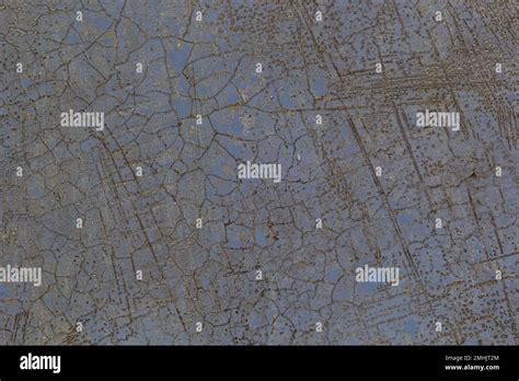 The Old Metal Surface Is Covered With Cracked Gray Paint With Rust Spots Stock Photo Alamy