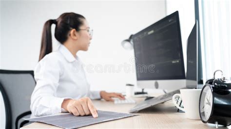 Young Asian Woman Programmer Typing Code Working With Computer At Table Coding Cyberspace And