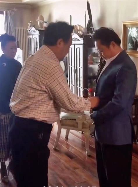 70 Year Old Tang Guoqiang Is Meeting Friends In His Mansion Wearing Reading Glasses And Getting