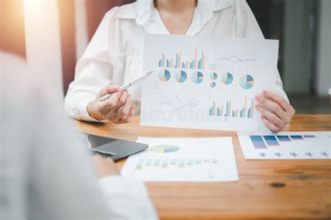 Group Of Business People Analysis Summary Graph Reports Of Business Operating Expenses Stock