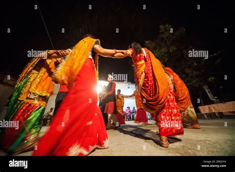 Group Of Indian Womans Wearing Colorful Saris Performing A Traditional