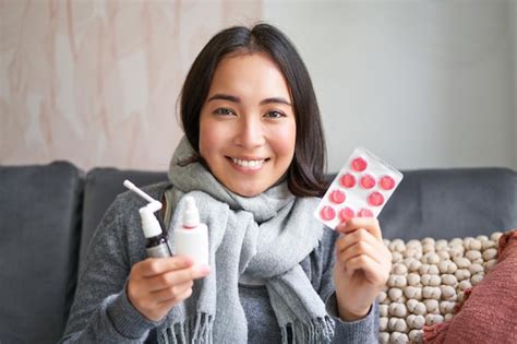 Free Photo Portrait Of Happy Smiling Asian Girl Showing Medication