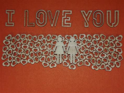 Lgbt Same Sex Love Between Two Women The Image Of Wooden Figures Of Women Among Hearts Stock