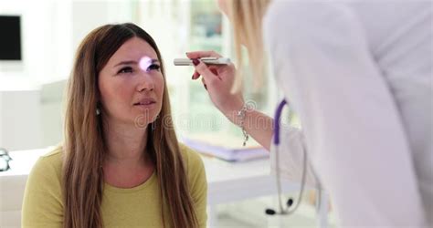 Doctor Checks Reaction Of Patient Pupils With Flashlight Stock Video