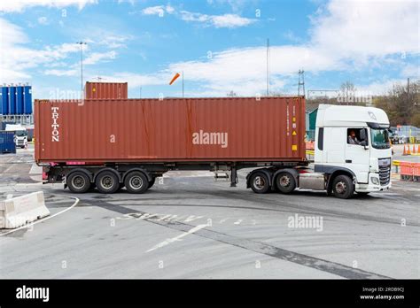Shipping Containers Being Loaded Onto HGV Vehicle At An Inland