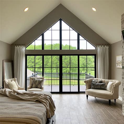 Luxurious Bedroom With Large Bed And Tall Glass Window