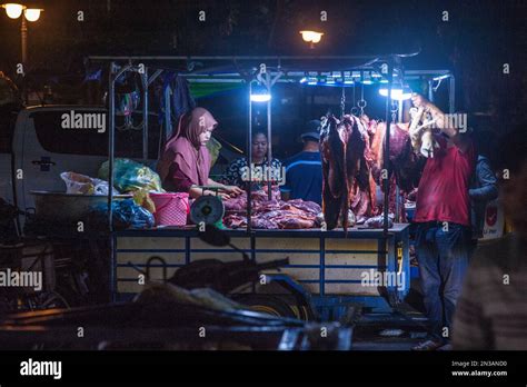A Muslim Woman Selling Raw Meat At The Main Wholesale Vegetable And Meat