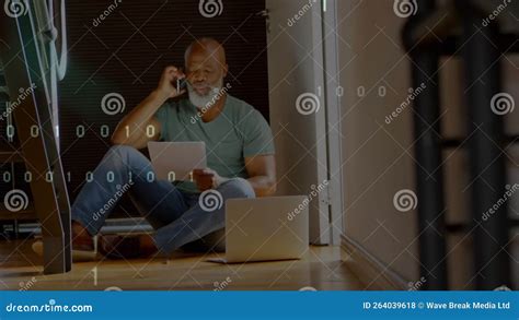 Animation Of Binary Coding Over African American Man Holding Document