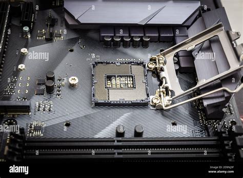 Closeup Detail Of CPU Socket Of A Modern Computer Black Motherboard Electronic Small Component